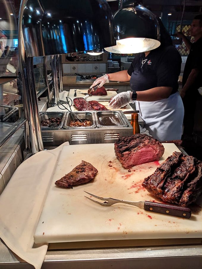 The prime rib carving station &ndash; where skilled hands transform beef into memories, one perfectly pink slice at a time.
