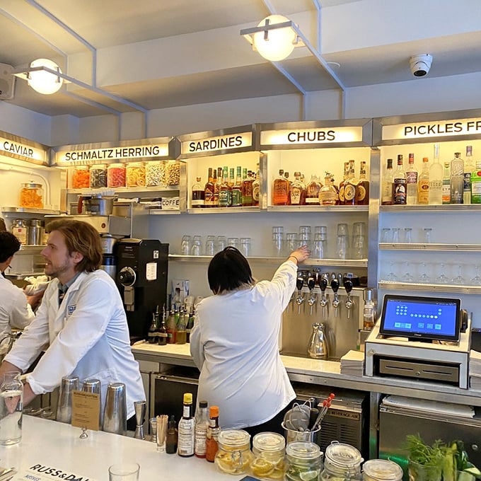 Behind the counter, skilled hands perform the daily ritual of slicing, assembling, and serving that's been perfected over decades.