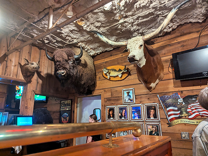 Mounted buffalo and longhorn heads watch over diners like guardians of beef tradition. They seem to nod in approval at every satisfied bite.