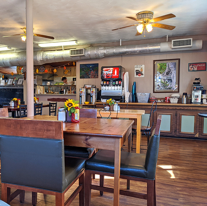 Sunflowers brighten wooden tables while ceiling fans keep the air moving &ndash; country caf&eacute; ambiance that money can't manufacture.