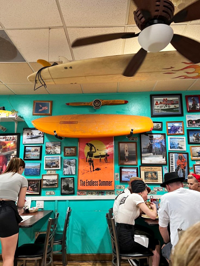 Where servers become family and hats are optional. The staff moves with the choreographed efficiency that only comes from years of experience.