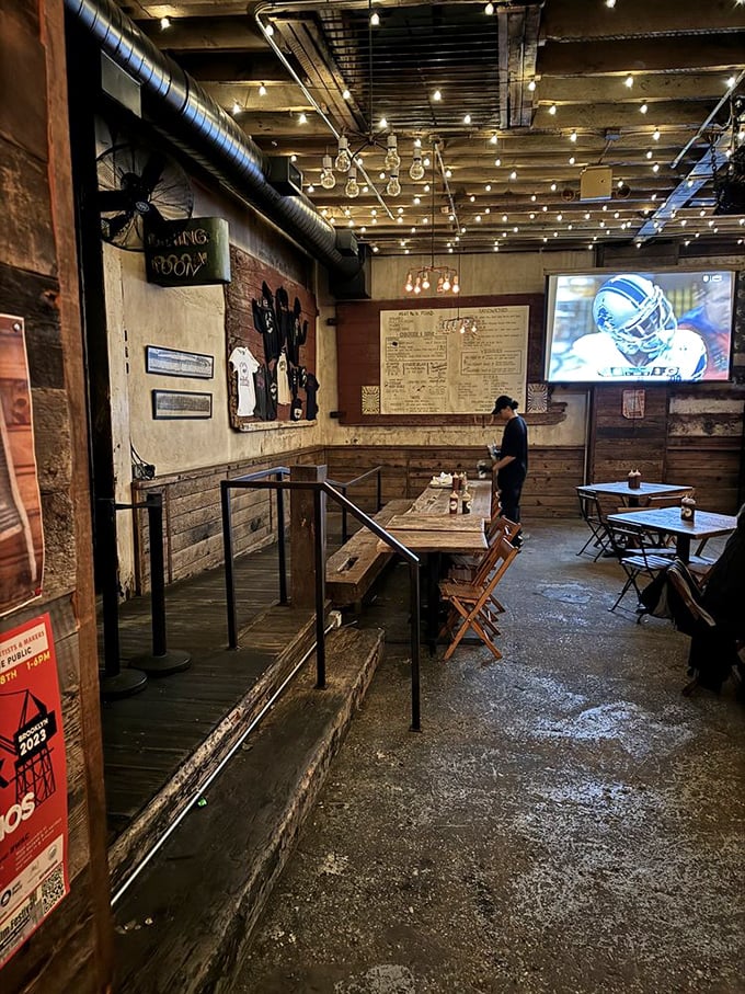 The dining area's multi-level design creates intimate spaces within the larger room, like barbecue neighborhoods within this smoky metropolis.