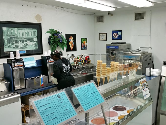 The workspace of frozen custard artisans, where magic happens daily. Note the vintage photos on the wall&mdash;this place has history in every scoop.