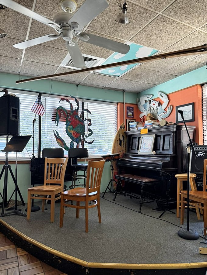 That piano and small stage hint at evening entertainment, but the real star performance happens on your plate. The painted crab seems to agree.
