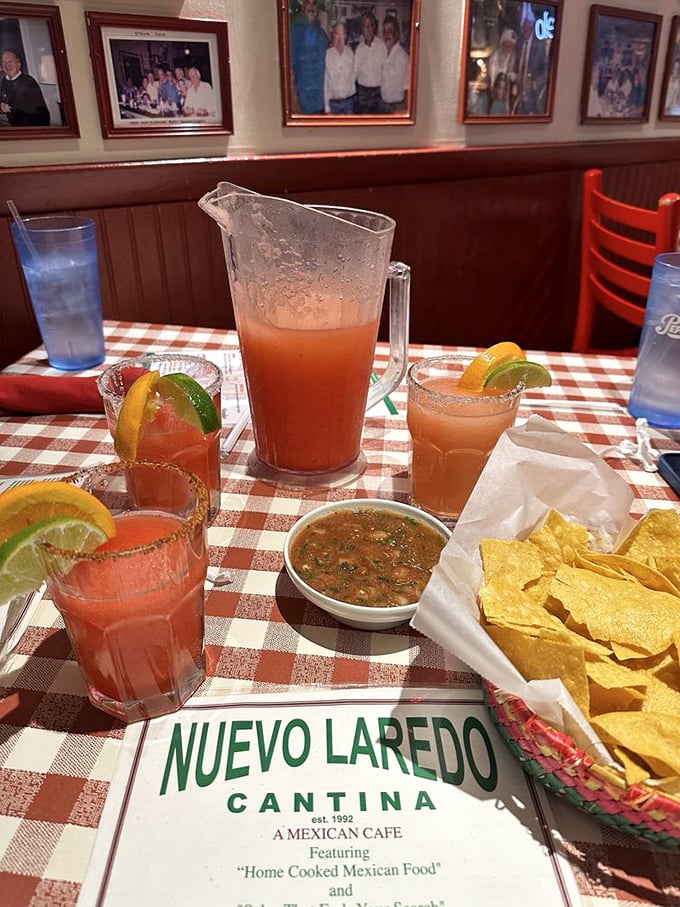 Strawberry margaritas served with lime wedges and fresh chips creating the holy trinity of Mexican restaurant happiness. Resistance is futile, just surrender to the joy.