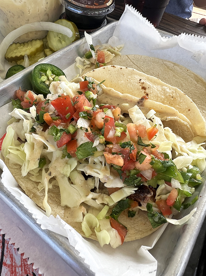 Tacos reimagined through a smoke-tinged lens. Fresh, vibrant toppings dance with barbecued meat in a corn tortilla ballroom of flavor.