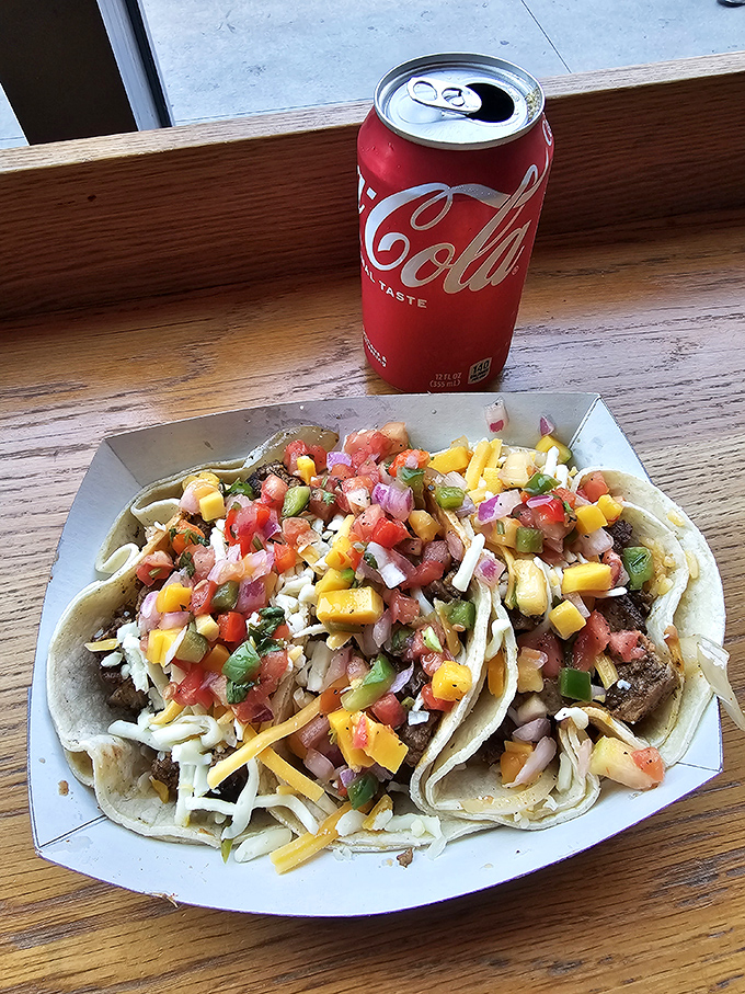 These tacos come dressed to impress with a confetti of fresh toppings – proof that sometimes the best parties happen on a corn tortilla.