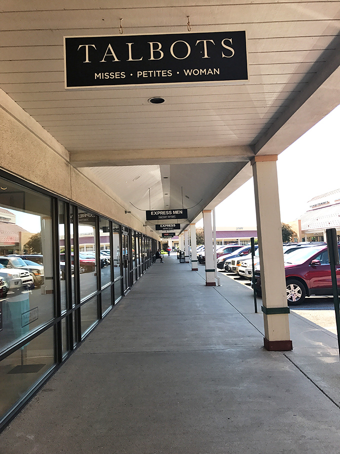 Talbots' elegant signage hangs above the covered walkway, offering shoppers protection from both weather and full retail prices.