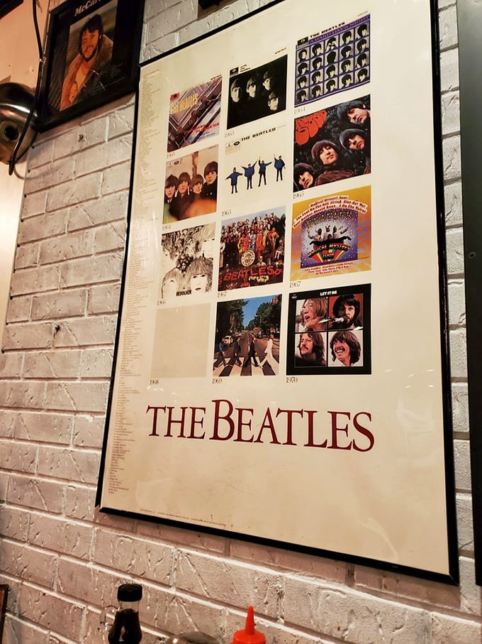 Beatles fans can "Come Together" at this booth, surrounded by album covers that chronicle the Fab Four's legendary musical journey.