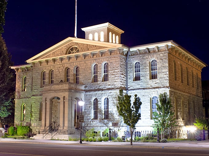 The Nevada State Museum glows with evening light, housed in the former Carson City Mint where millions in silver coins were once struck.