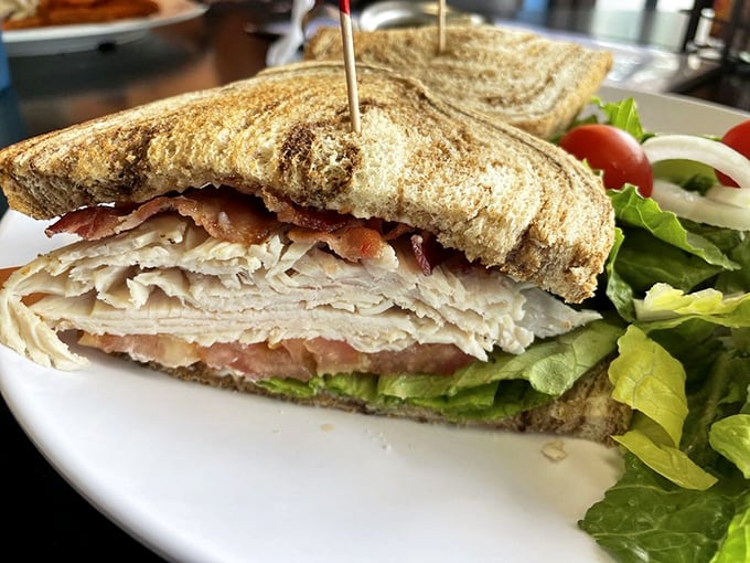 This turkey BLT isn't just a sandwich—it's architecture. Layers of thinly sliced turkey and bacon create the skyscraper of lunch options you've been searching for.
