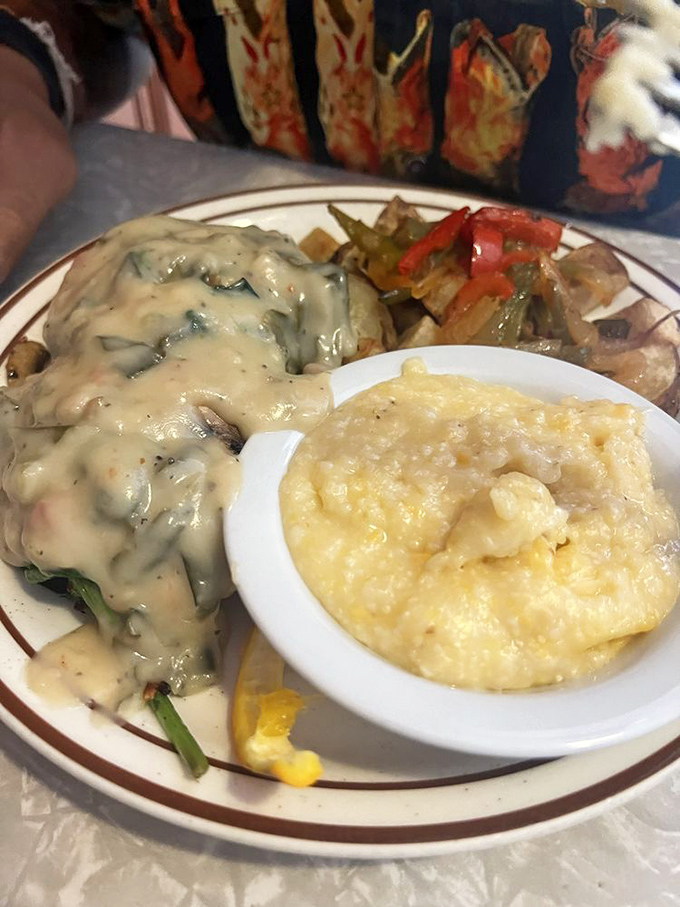 The vegetarian biscuit and gravy proves that meatless dishes can be just as indulgent&mdash;a creamy hug served with golden grits.