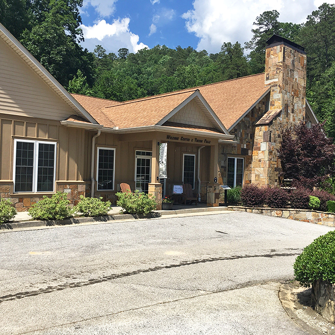 The welcoming visitor center blends seamlessly into its natural surroundings, like a cozy mountain cabin that happens to sell postcards.