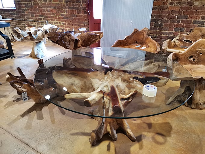 Nature meets design in this showstopping table where organic tree roots support a glass top - conversation piece doesn't begin to describe it.
