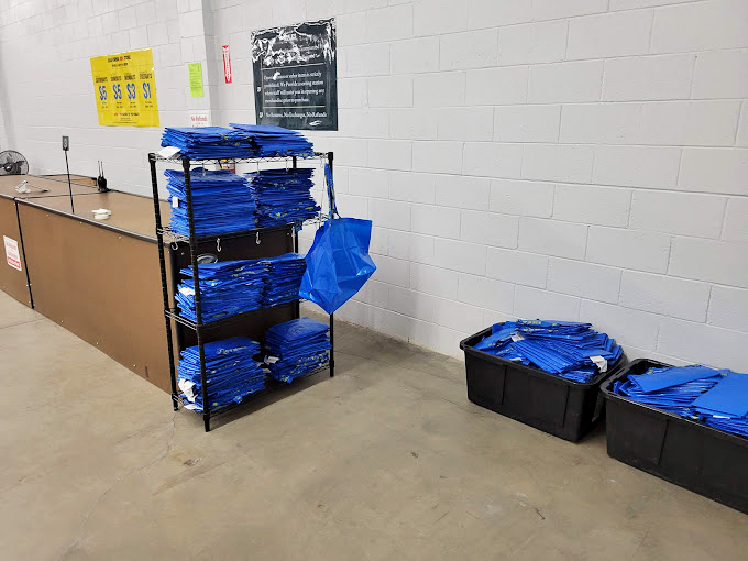 Blue bags waiting for their moment to shine. The unsung heroes of the bin store experience, ready to carry home your unexpected victories.