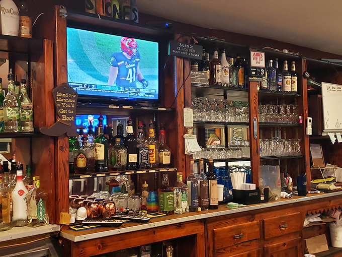 Behind the bar, an impressive selection of spirits stands ready while sports play on the TV &ndash; the unofficial community center of Millhousen.