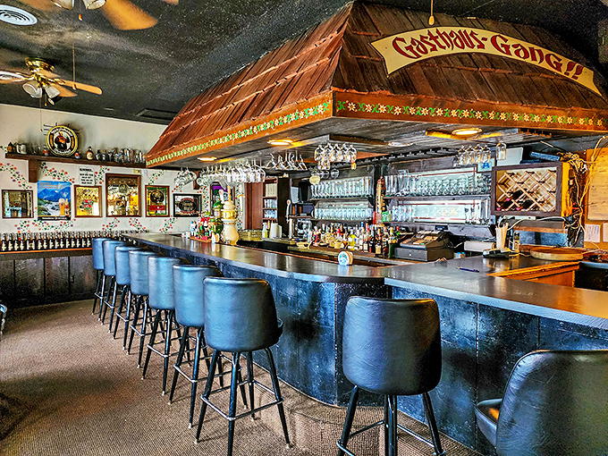 The bar area looks like it was teleported straight from Bavaria, where beer steins hang expectantly, waiting for their moment to shine.