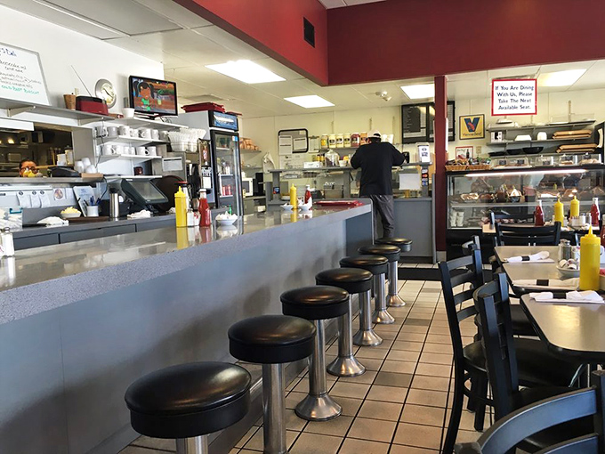 The diner counter view never gets old. Yellow mustard bottles standing at attention, ready for sandwich duty.