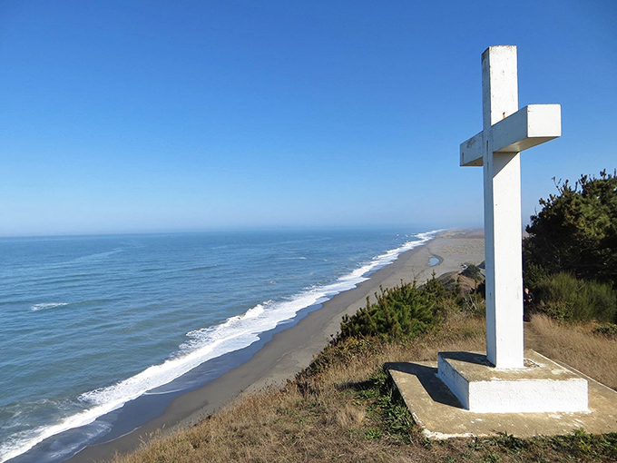 A simple white cross marks this stunning coastal viewpoint. The endless horizon reminds visitors of their small place in a vast and beautiful world.
