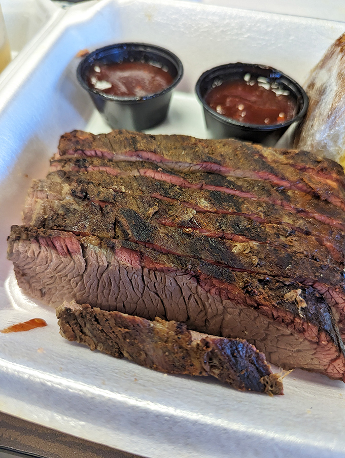 Brisket doesn't lie. That smoke ring tells the story of patience, while the bark whispers secrets of spice blends guarded more carefully than family jewels.