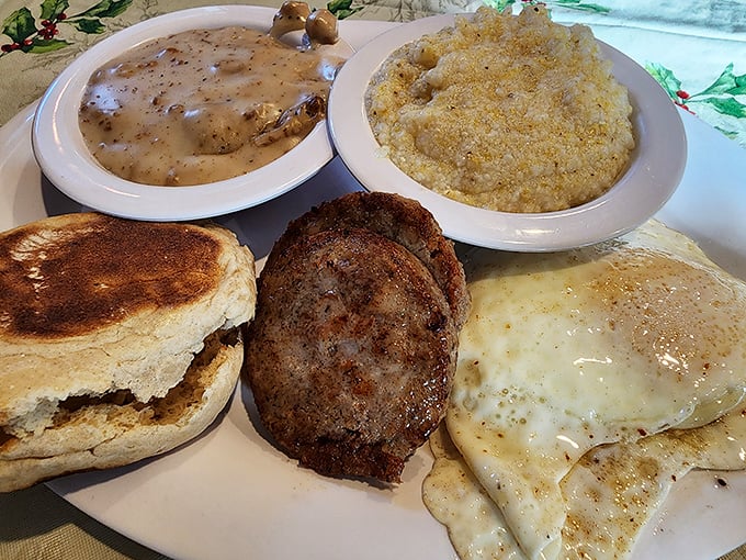 Comfort on a plate: country gravy, grits, sausage, and eggs that remind you why breakfast will always be the superior meal of the day.