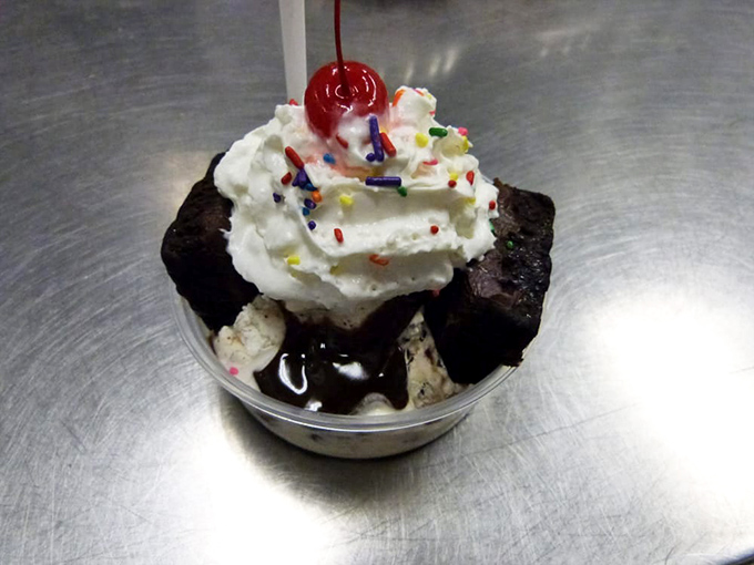 A brownie sundae that deserves its own Instagram account. Hot fudge cascades over ice cream like a chocolate waterfall of joy.