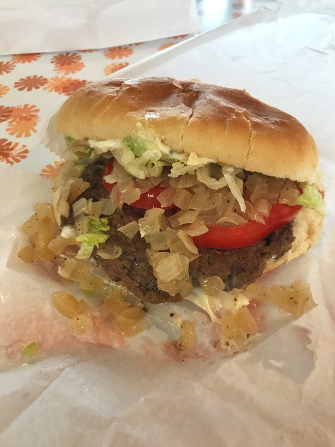 A burger piled high with the works—proof that sometimes the classics need no improvement, just proper execution.