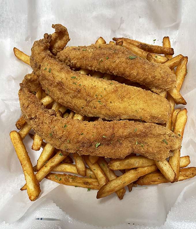 These golden catfish strips aren't just fried &ndash; they're transformed into crispy wands of deliciousness that would make any seafood lover weep with joy.