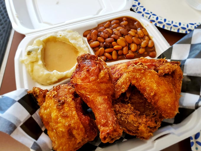 This isn't just a meal; it's a masterpiece of Southern comfort. Crispy chicken, creamy mashed potatoes with gravy, and baked beans that mean business.