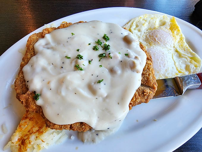 Vaulted ceilings and log beams create a cathedral-like atmosphere where diners worship at the altar of comfort food. 