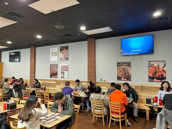 A busy dining room filled with the universal expression of food joy. When a restaurant is this good, words become optional &ndash; just point and nod.