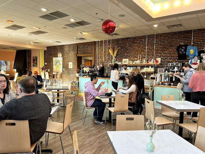 A gathering place for food lovers of all stripes – where conversations flow as freely as the coffee in this welcoming space.