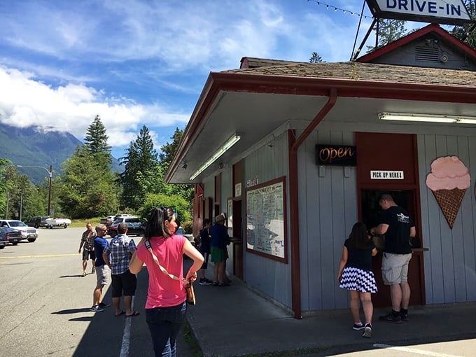 The universal language of anticipation: Travelers from all walks of life converge at this humble outpost of burger perfection.