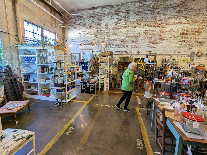 Exposed brick walls and original industrial features create the perfect backdrop for browsing—proof that old buildings, like old things, have stories worth preserving.