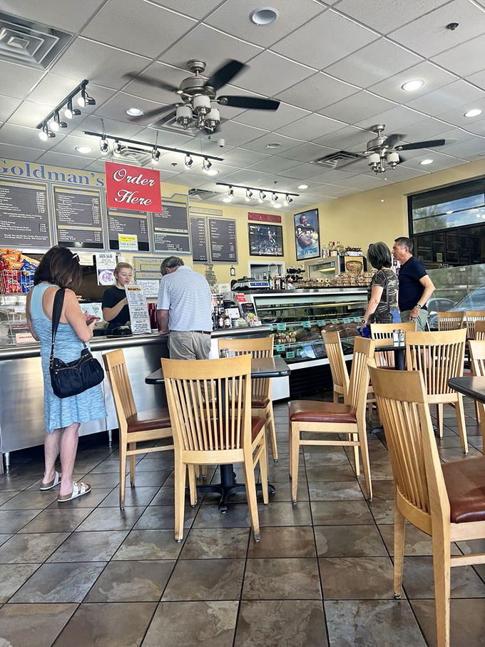 The true measure of a great deli? Happy customers lost in the moment, contemplating nothing but their next perfect bite.