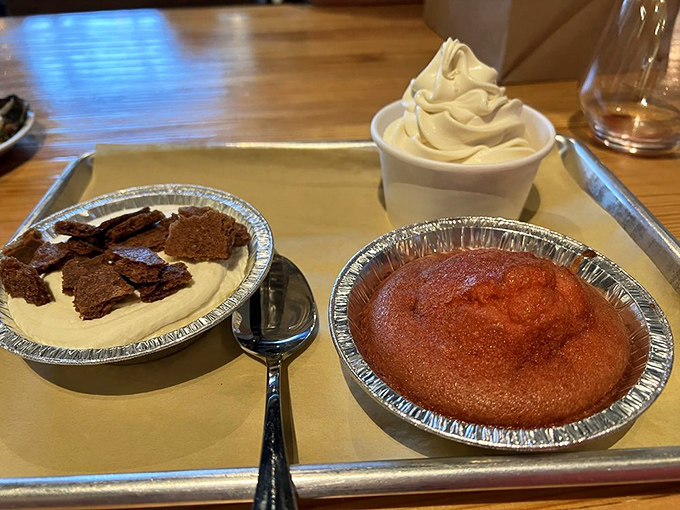 The dessert trinity: banana pudding, soft serve, and something warm and cakey&mdash;because saving room is always worth it.