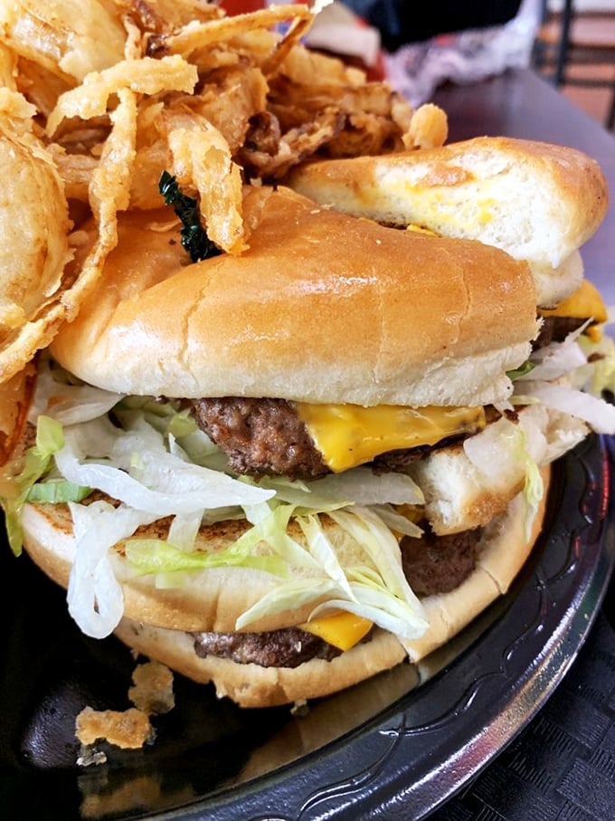 This double cheeseburger with crispy onion rings isn't just a meal—it's a commitment, a relationship, a journey you embark on together.
