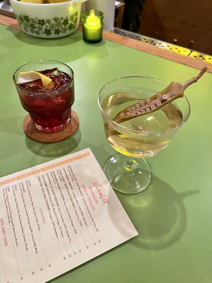 Cocktails that complement rather than compete with the food. That squid garnish isn't just for show&mdash;it's a conversation starter in a glass.