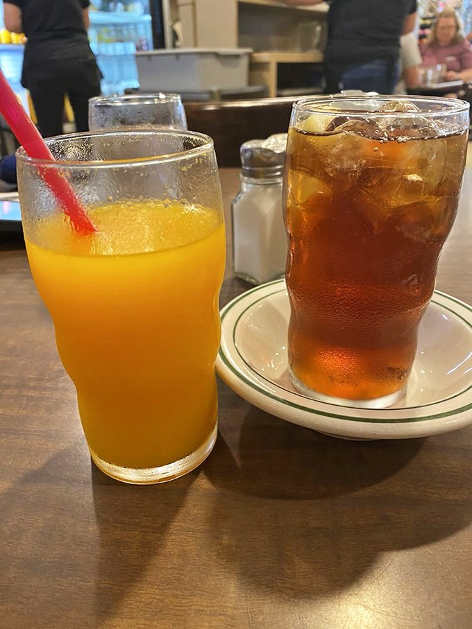 Fresh-squeezed orange juice so vibrant it could jumpstart your day better than caffeine. The iced tea stands by, ready for the afternoon shift.