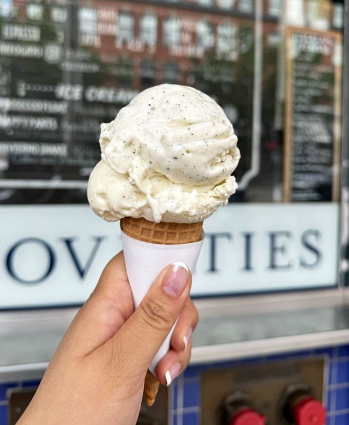 Ice cream cone perfection in its natural habitat. That scoop isn't just balanced—it's performing a structural engineering miracle worthy of a Nobel Prize.
