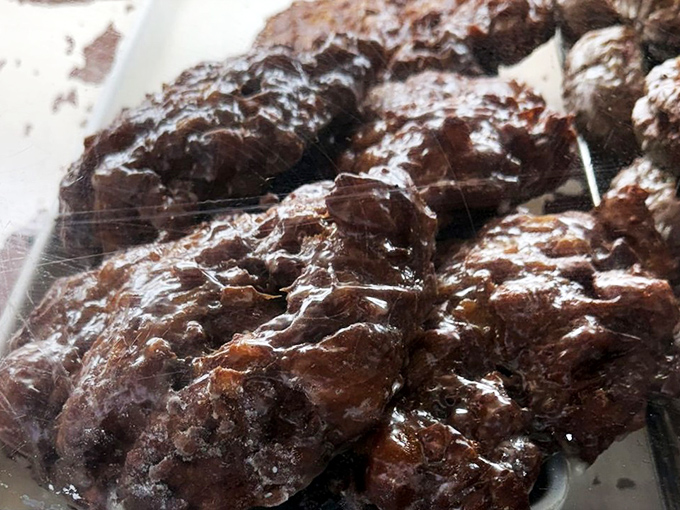 Chocolate donut clusters huddle together under plastic, plotting their escape into your shopping bag and eventually your delighted stomach.