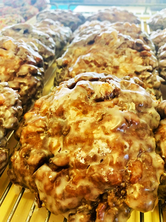 These apple fritters aren't just donuts—they're topographical maps of Flavor Country with peaks of cinnamon and valleys of apple.