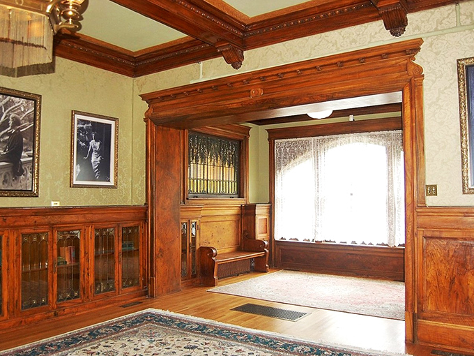 The castle's interconnected rooms flow with a grace modern open-concept homes can only envy. That doorway frame contains more craftsmanship than most contemporary houses combined.