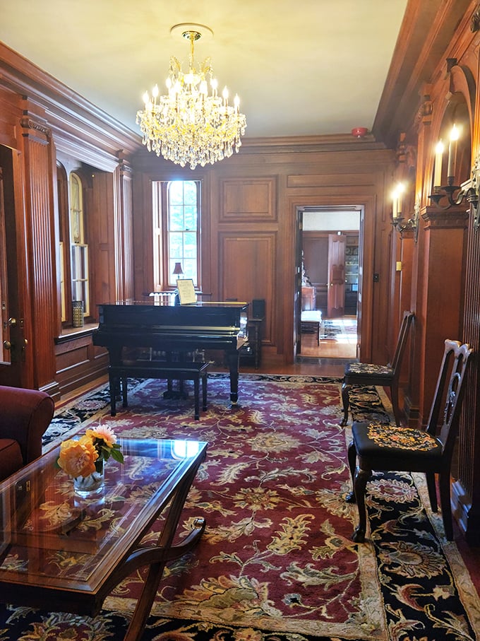 This elegant room with its grand piano and crystal chandelier practically begs for a sophisticated soir&eacute;e. Chopin, anyone?