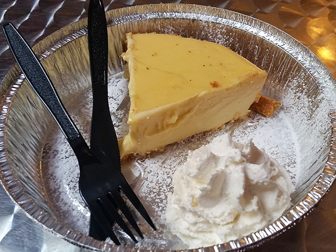 Key lime pie with a dollop of whipped cream. That perfect yellow hue isn't food coloring&mdash;it's the real deal, folks.