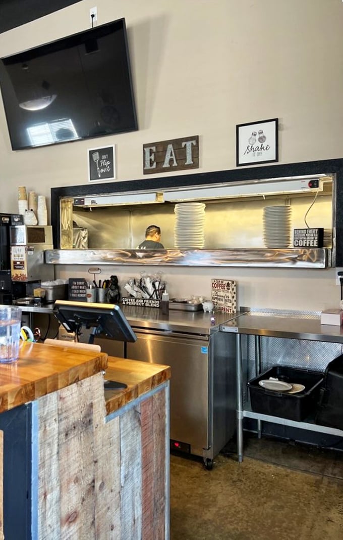 A kitchen pass that offers a glimpse into the organized chaos where breakfast dreams are made real by skilled hands.