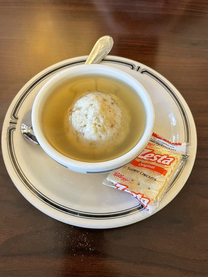 The matzo ball soup arrives like penicillin for the soul&mdash;a golden broth harboring the fluffiest dumpling this side of the Mississippi.