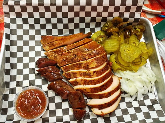 A meat platter that makes carnivores weep with joy. Sliced turkey, sausage, and pickles create the holy trinity of barbecue satisfaction.