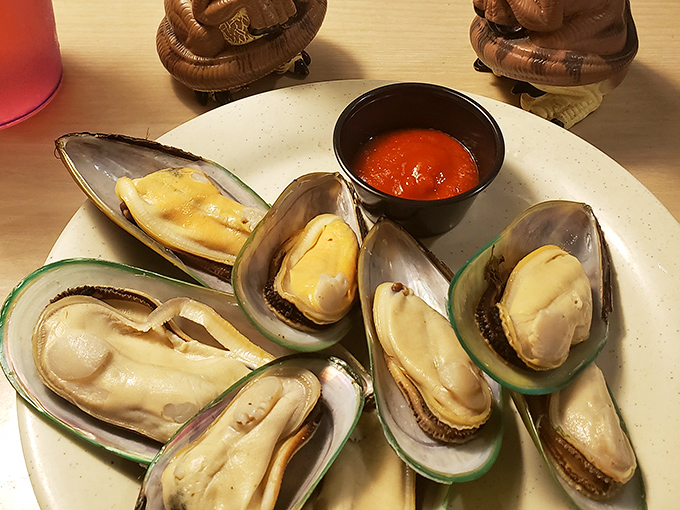 These mussels have dressed in their finest shells for the occasion, accompanied by a dipping sauce that's their perfect dance partner.