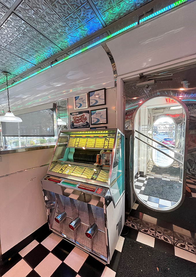 The embossed metal ceiling catches colorful light from the holiday-style LEDs. Even the jukebox looks ready to serve up some classic tunes with your meal.
